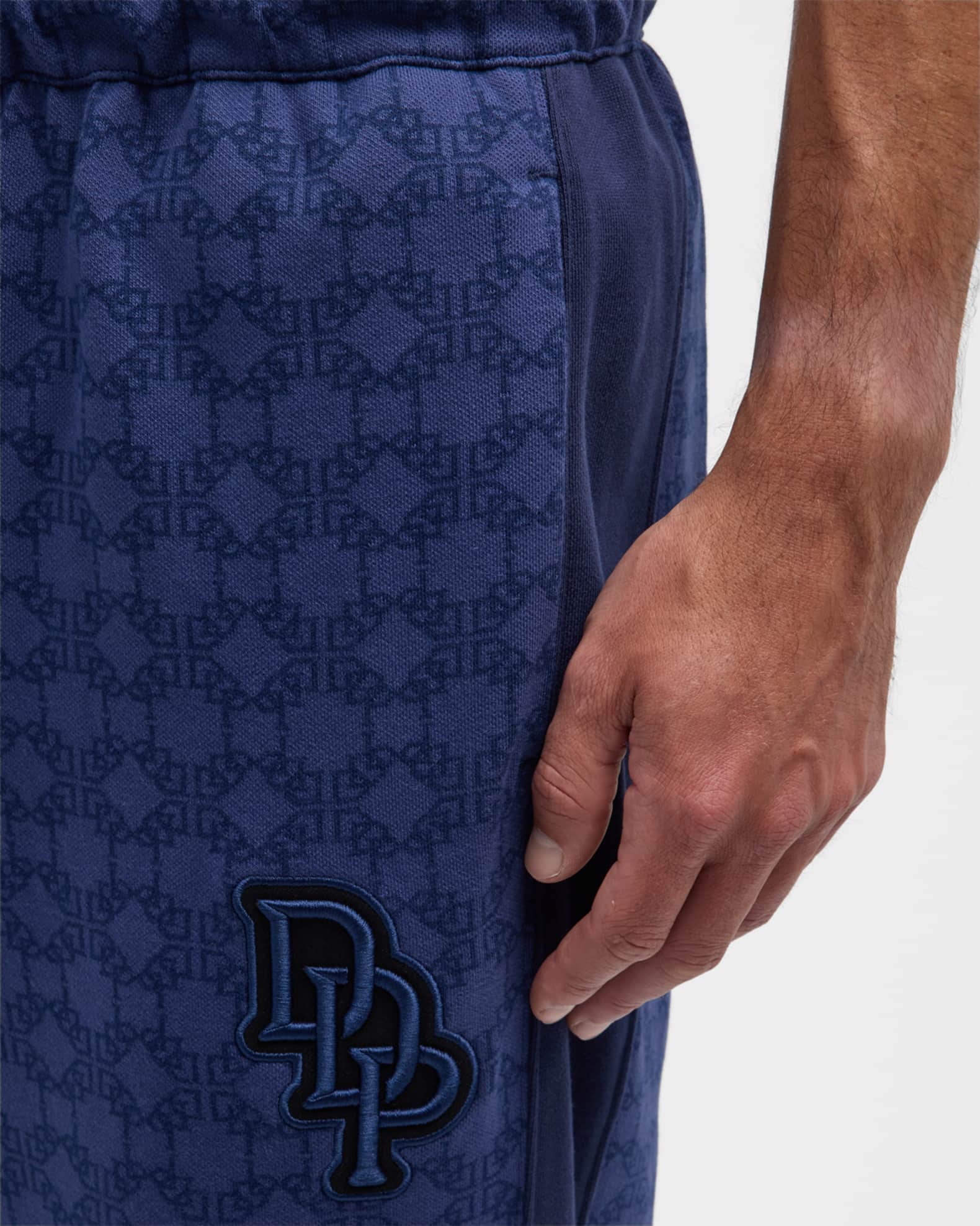 Puma x Dapper Dan Men's Monogram Pants | Neiman Marcus